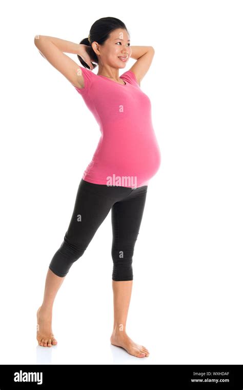 Full Length Healthy Asian Pregnant Woman Doing Yoga Exercise Stretching