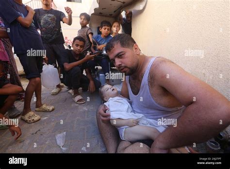 A Palestinian Man Mourns The Body Of His Two Year Old Son Yaman Mahmoud Miqdad A Palestinian