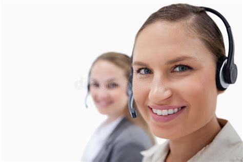 Operadores De Sexo Femenino Jovenes Que Usan Las Auriculares Foto De