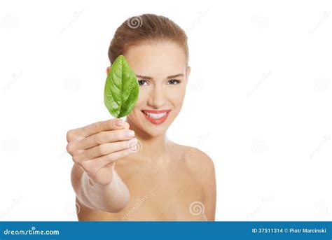 Beautiful Caucasian Topless Woman With One Green Leaf Stock Photo