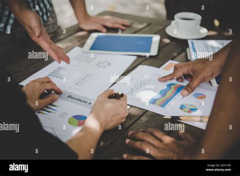 Group Of Business People Analysis With Marketing Report Graph Young Specialists Are Discussing