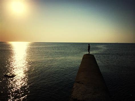 Premium Photo Silhouette Of A Person Standing On A Jetty