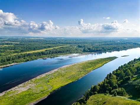 Flat River With A Large Island Covered With Small Vegetation Stock