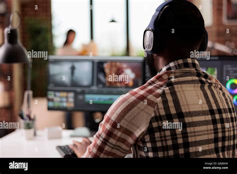 Video Editor Editing Film Footage On Software Using Visual Effects And