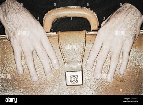 Hands Of Businessman Holding Briefcase Stock Photo Alamy