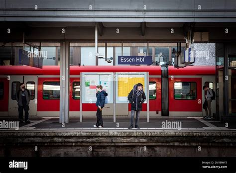 Picture Of Men Waiting For A Train On The Platforms Of Essen