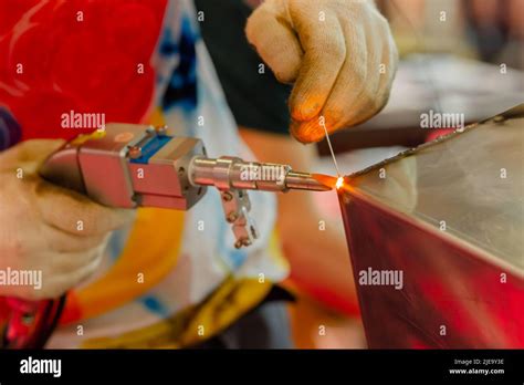 Close Up Welder Hands Using Handheld Laser Welding Machine Stock Photo Alamy