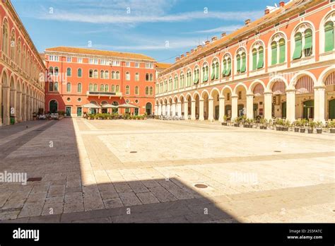 A Spacious Courtyard At The Republic Square Surrounded By Classical