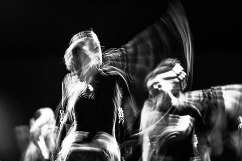 Premium Photo Blurred Motion Of Dancer Dancing Against Black Background