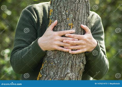 Man Hugging A Tree In A Forest Stock Image Image Of Plant Colorful