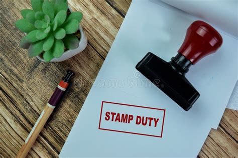 Concept Of Red Handle Rubber Stamper And Stamp Duty Text Isolated On On