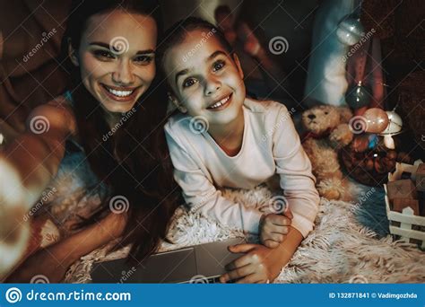 Mother And Daughter Is Doing A Selfie On Cellphone Stock Image Image