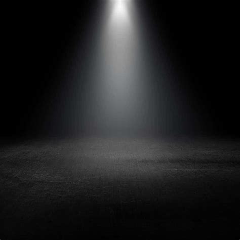 Download Dramatic Spotlight On A Dark Stage Wallpaper