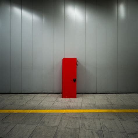 Premium Photo Red Locker Against Gray Wall