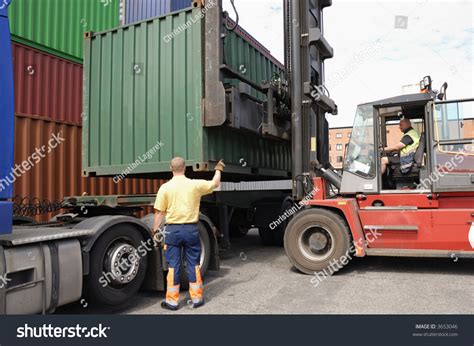 Truck And Driver Loading Truck With Container Truck Driver Directing