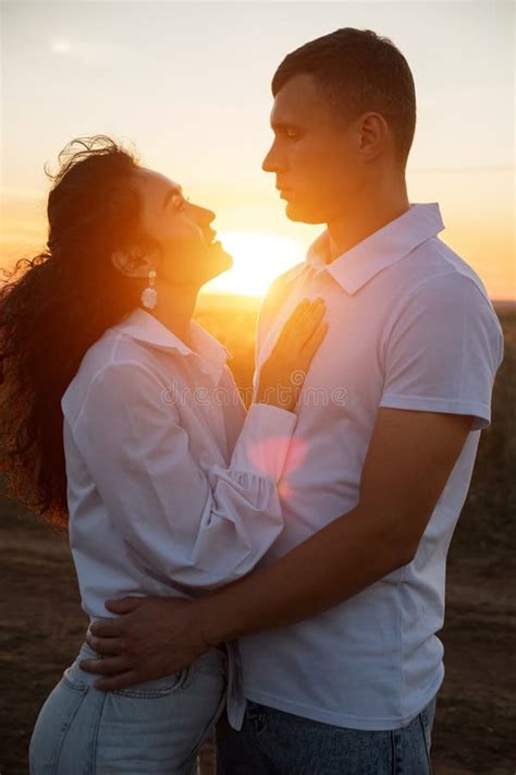 Romantic Relationship Between Lovely Man And Woman At Sunset Stock