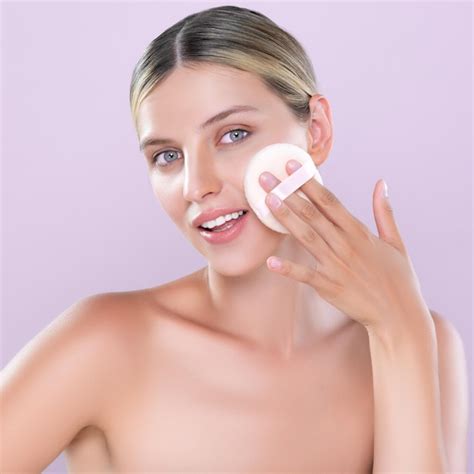 Premium Photo Alluring Beautiful Female Model Applying Powder Puff For Facial Makeup Concept