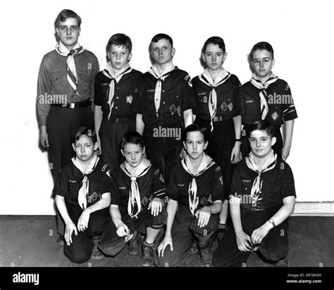 Members Of An American Cub Scout Den Pose For A Group Photograph In The