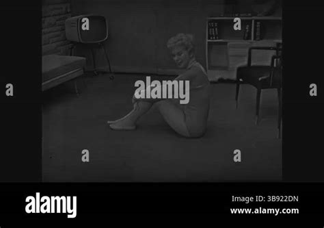 United States 1961 Debbie Drake Work Out Her Thighs With An Exercise Routine While Sitting