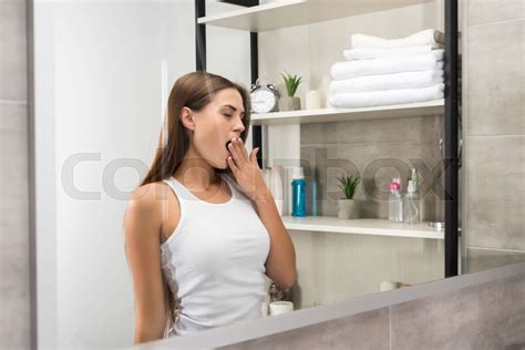 Girl Yawning In Bathroom Stock Image Colourbox
