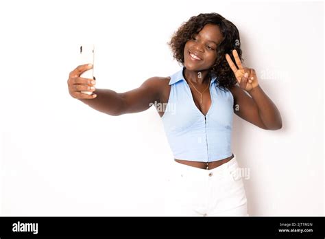 Photo Of Dark Skinned Lady Enjoys Distant Communication Uses Mobile