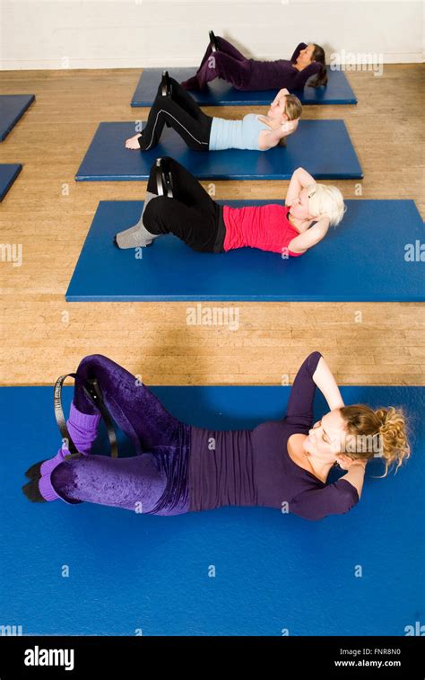 Pilates Curl Up Position Using An Inner Thigh Squeezing Fitness Stock