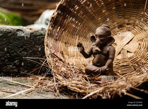 Eco Friendly Lord Ganesha Made Of Natural Clay Kept Under A Bamboo
