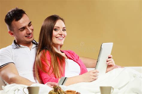 Young Couple With Tablet And Credit Card At Home Stock Image Image Of
