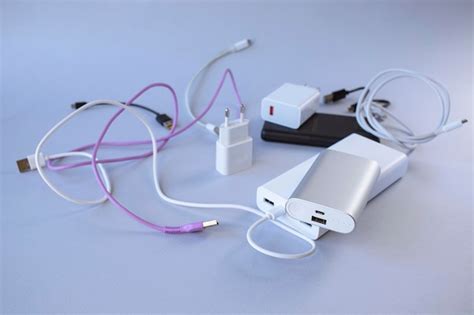 Premium Photo Power Bank External Battery And Usb Wire On The Table