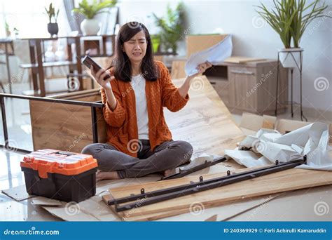 Frustrated Asian Woman While Assembling New Furniture Stock Image Image Of Interior Assembly
