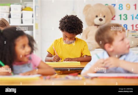 Staying Focused In Class Preschool Students Colouring In Class Stock
