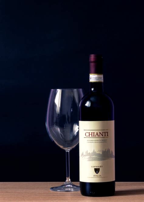 Chianti Labeled Bottle And Clear Long Stem Glass On Table Free Photos