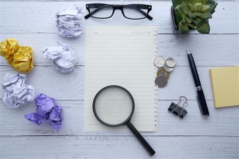 Premium Photo Colorful Crumpled Paper Ball Pen And Magnifying Glass