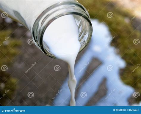 Spilled Milk Overturned Glass With Milk On Blue Background Dairy