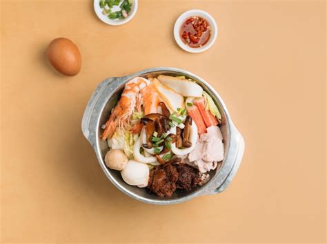 Premium Photo Tom Yum Xiao Wan In A Bowl With Soup Chili Sauce And