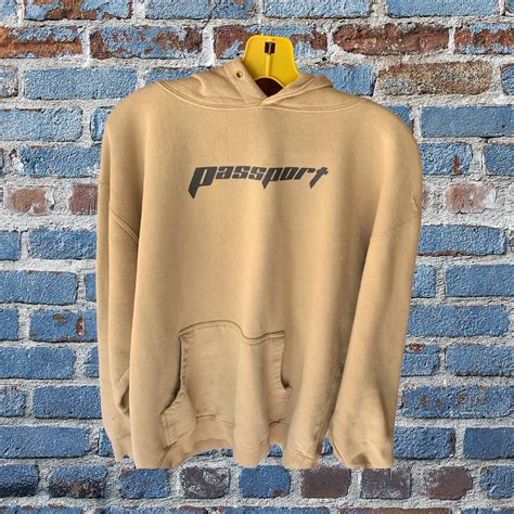 Passport Hoodie Tan Color Shows Some Minor Wear Depop