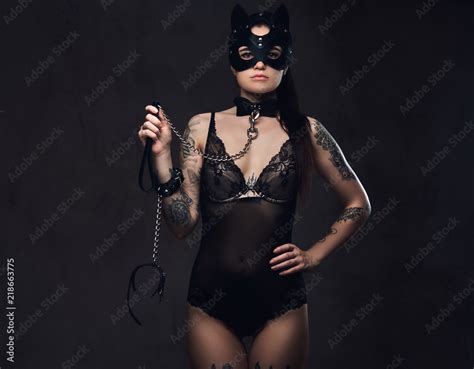 Sexy Woman Wearing Black Lingerie In Bdsm Cat Leather Mask And