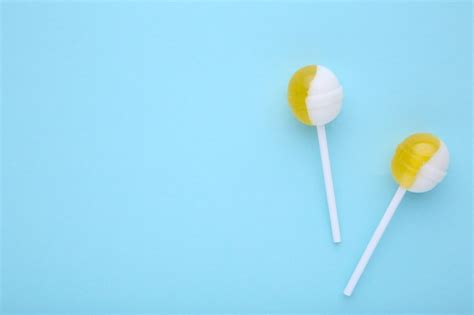Premium Photo Lollipops On Blue Sweet Candy Concept