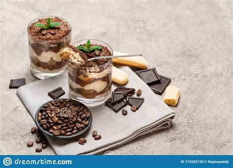 Classic Tiramisu Dessert In A Glass Cup Pieces Of Chocolate And