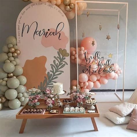 A Table Topped With Lots Of Balloons And Desserts