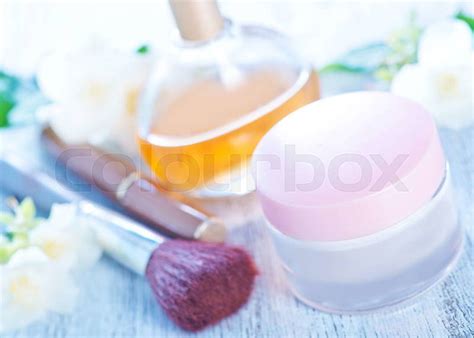 Cream for body in bank and on a table | Colourbox