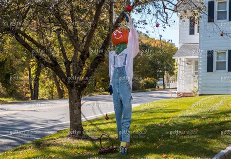 Scarecrows Are Decorated Around The Neighborhood For Fun Socially