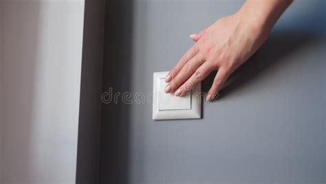 A Beautiful Female Hand Presses The Switch On The Wall Stock Image Image Of Control Gray