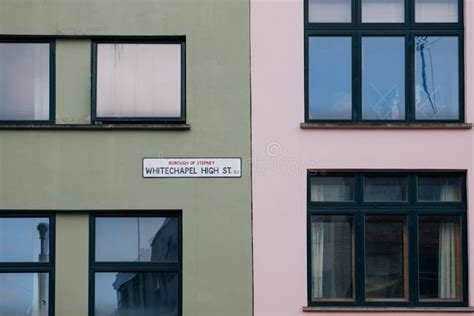 Street Name Sign On Pastel Coloured Buildings On Whitechapel High