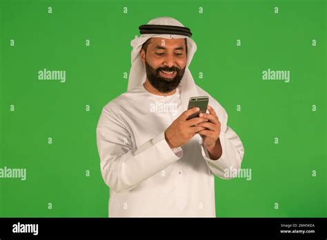 Emirati Man Using Mobile Phone Stock Photo Alamy