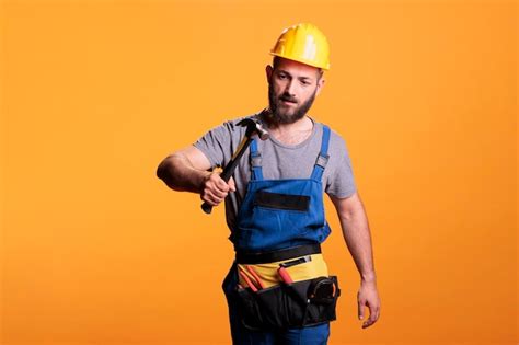 Premium Photo Engineer Standing Against Yellow Background