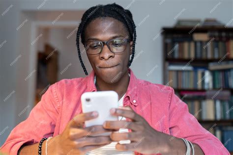Premium Photo Shy Introverted African American Man Chatting On Phone