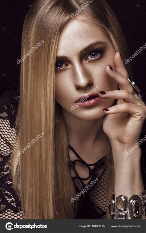 Beautiful Blond Woman With Healthy Skin And Hair Red Manicure Posing