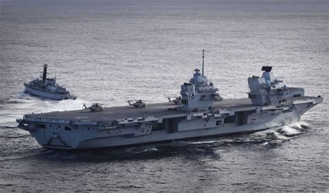 Hms Northumberland Manoeuvres Hard While Escorting Hms Queen Elizabeth