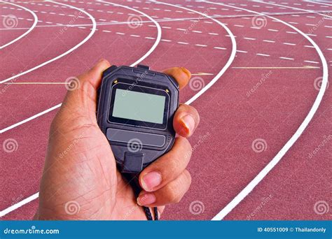 Close Up Man Holding Stopwatch To Measure Performances Stock Photos